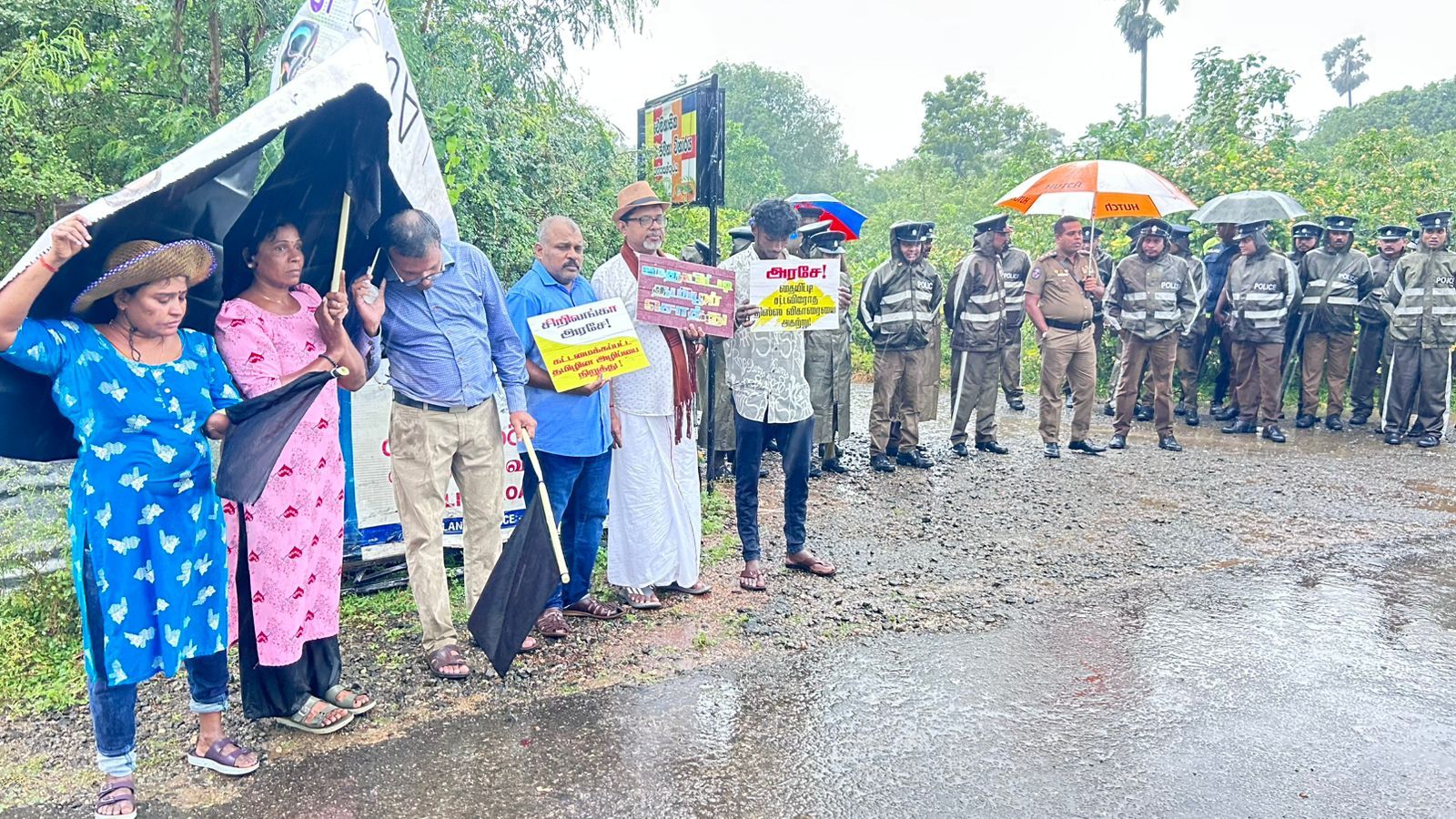 Thaiyiddy residents defy heavy rain in protest against Buddhist temple ...